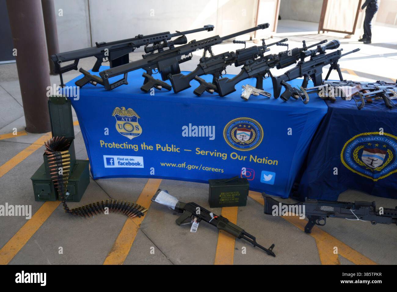 Seized weapons and other munitions sit on display during a press ...