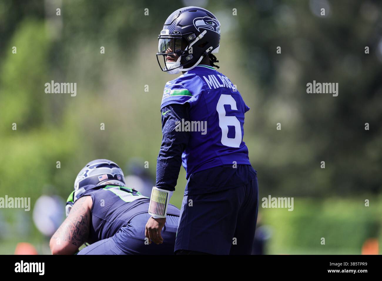 Seattle Seahawks quarterback Jalen Milroe prepares to take a snap ...
