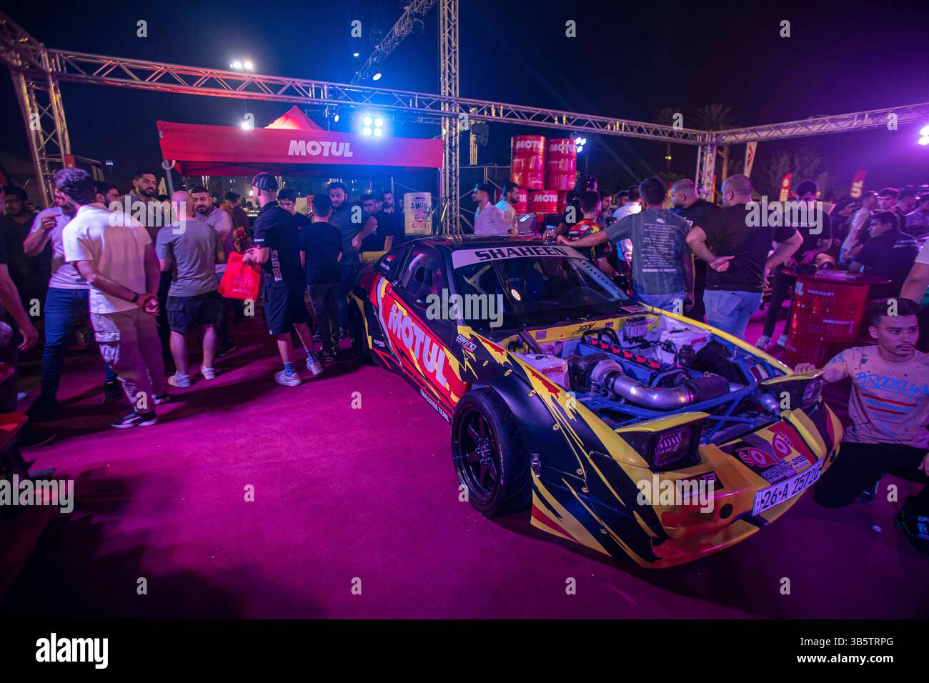 People attend a car show named "Baghdad Auto Show" in Sinbad Park in ...