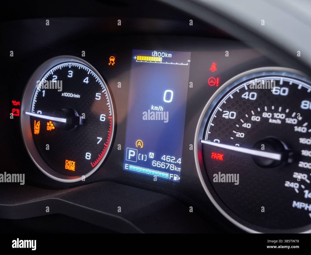 Warning lights illuminating car dashboard, gauges displaying zero speed ...