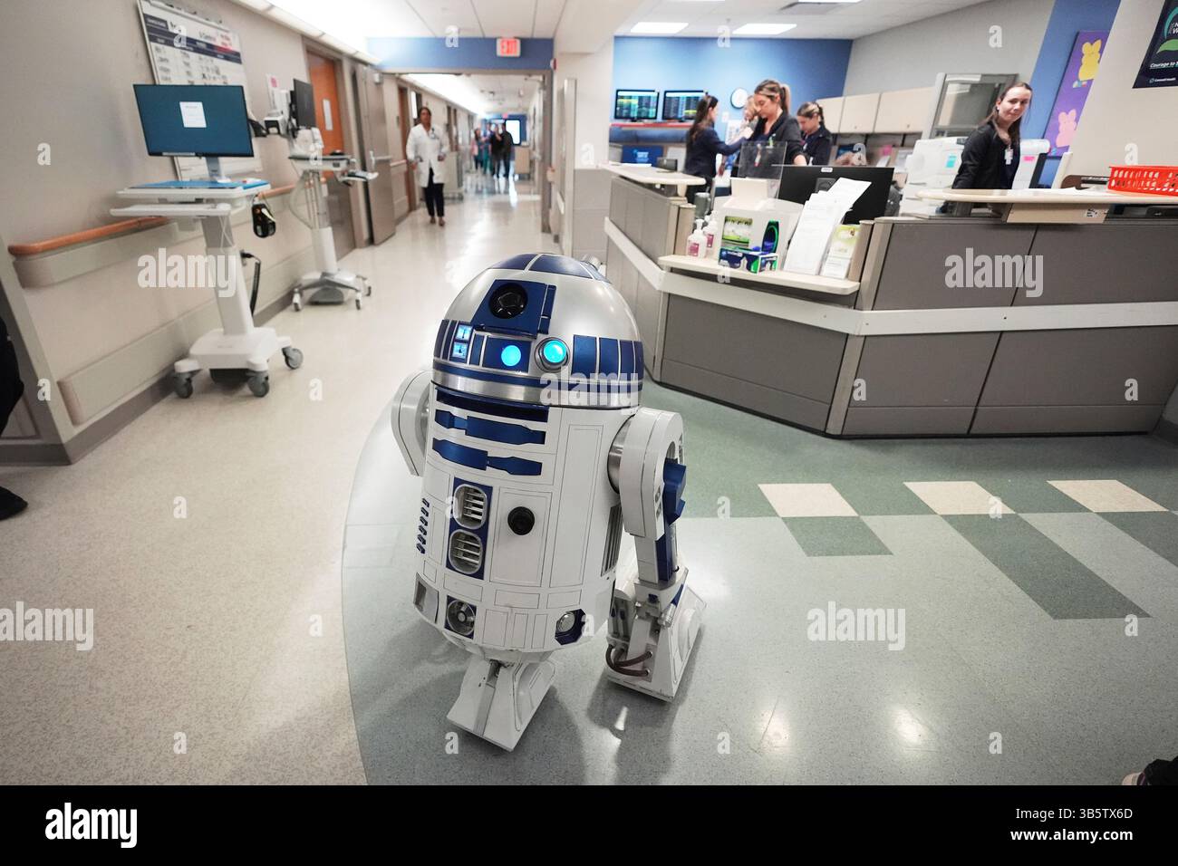 A "Star Wars" R2-D2 droid moves through Corewell Health Children's Hospital in Royal Oak, Mich ...