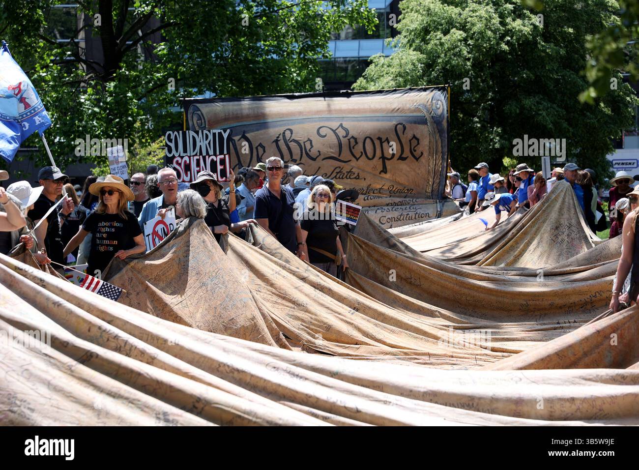 May Day Protest in Washington, USA - 01 May 2025. Demonstrators hold a ...