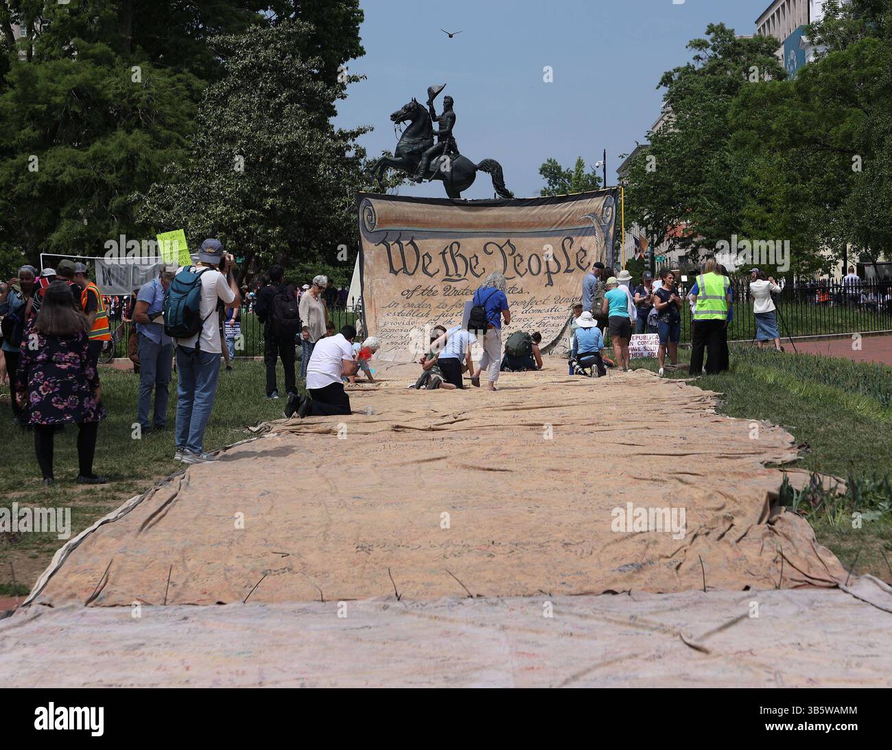 May Day Protest in Washington, USA - 01 May 2025. Protesters sign a ...
