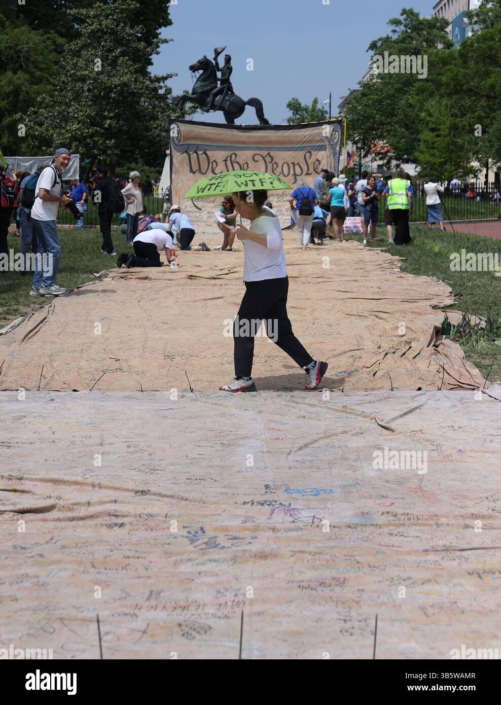 May Day Protest in Washington, USA - 01 May 2025. Protesters sign a ...