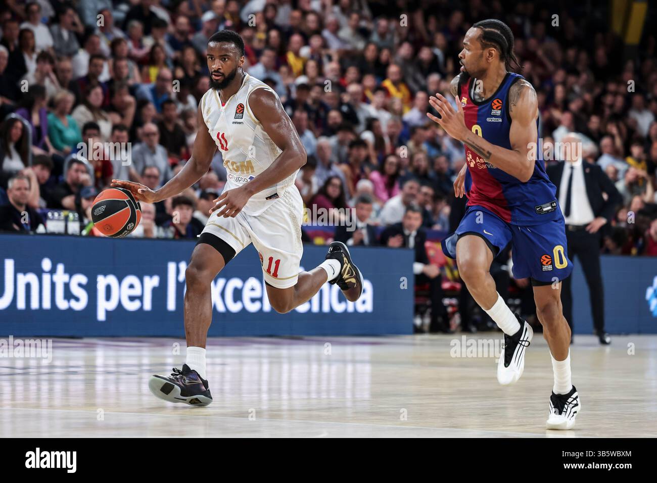 Alpha Diallo of AS Monaco and Kevin Punter of FC Barcelona in action ...