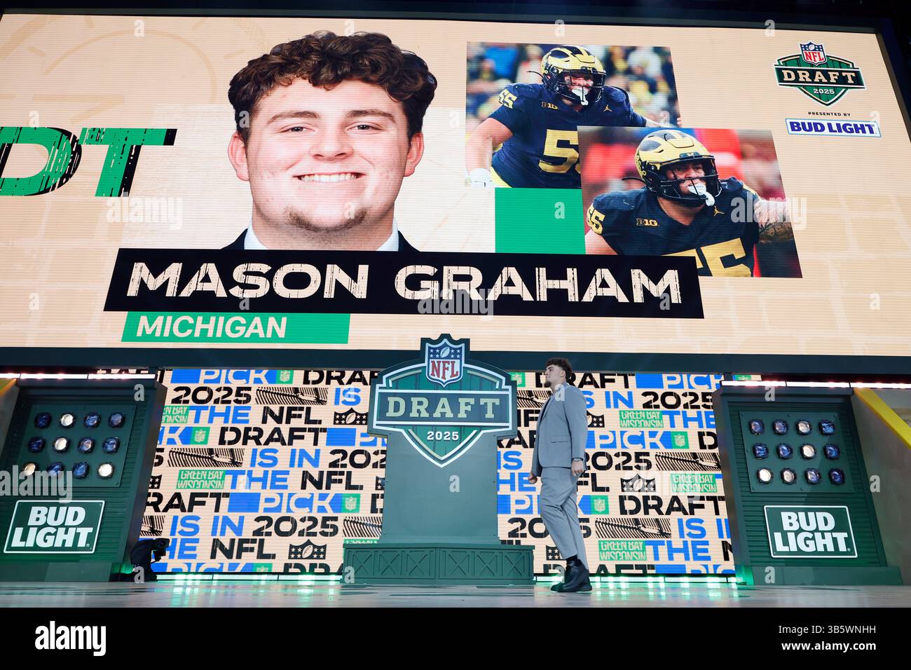 Michigan defensive lineman Mason Graham celebrates after being chosen ...