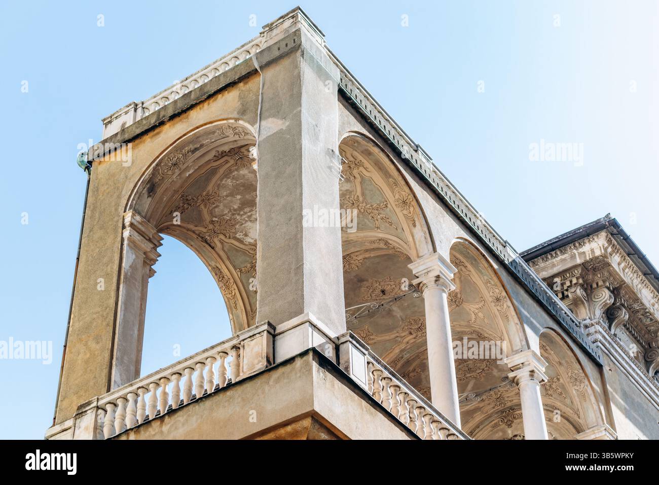Elegant Renaissance loggia with arched columns and ornate ceiling ...