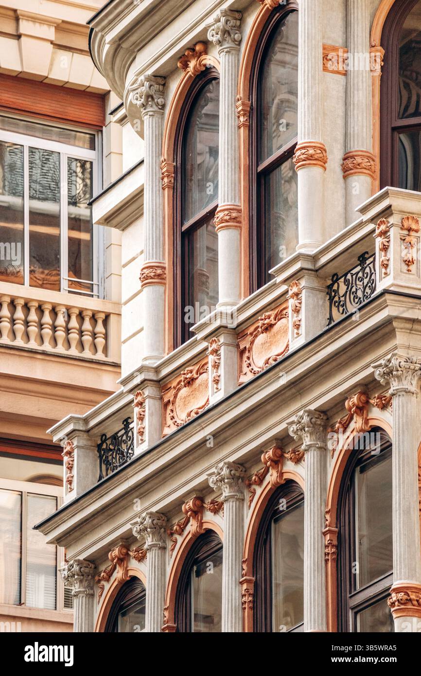 Ornate historic facades with arched windows, balconies, and rich stucco ...