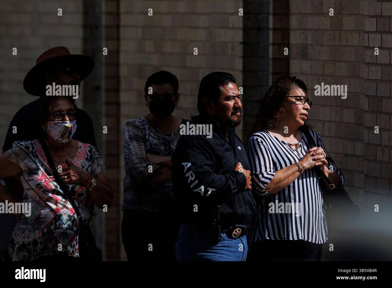 June 1, 2022, Uvalde, Texas, USA: People quietly watch as two caskets ...