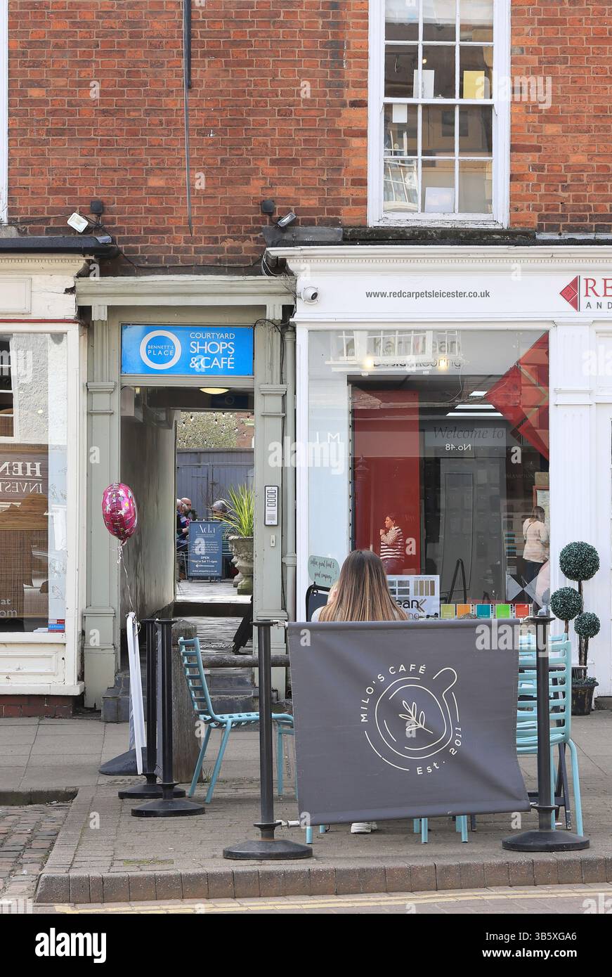 Shops & cafes on the High Street in charming market town Market ...