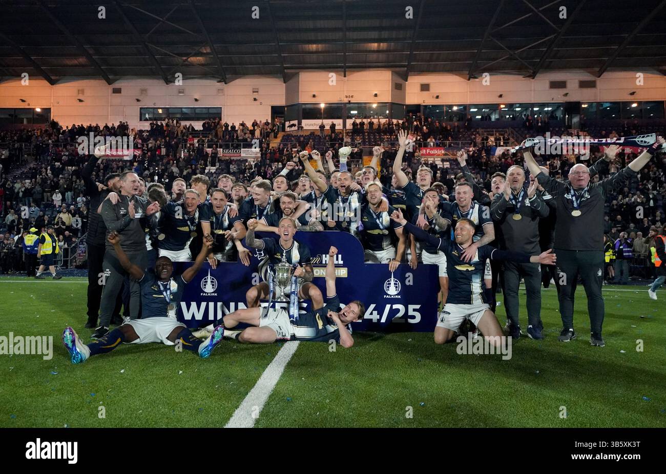 Falkirk players celebrate with the trophy at the final whistle after ...