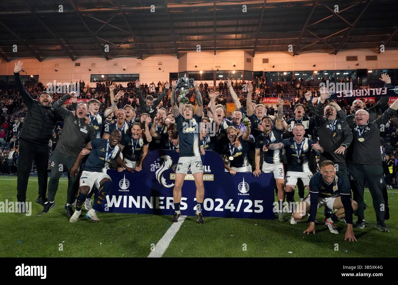 Falkirk players celebrate with the trophy at the final whistle after ...