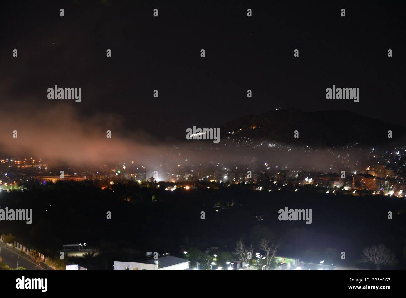 Damascus, Syria. 3rd May, 2025. Smoke rises from Mount Qasioun after an ...