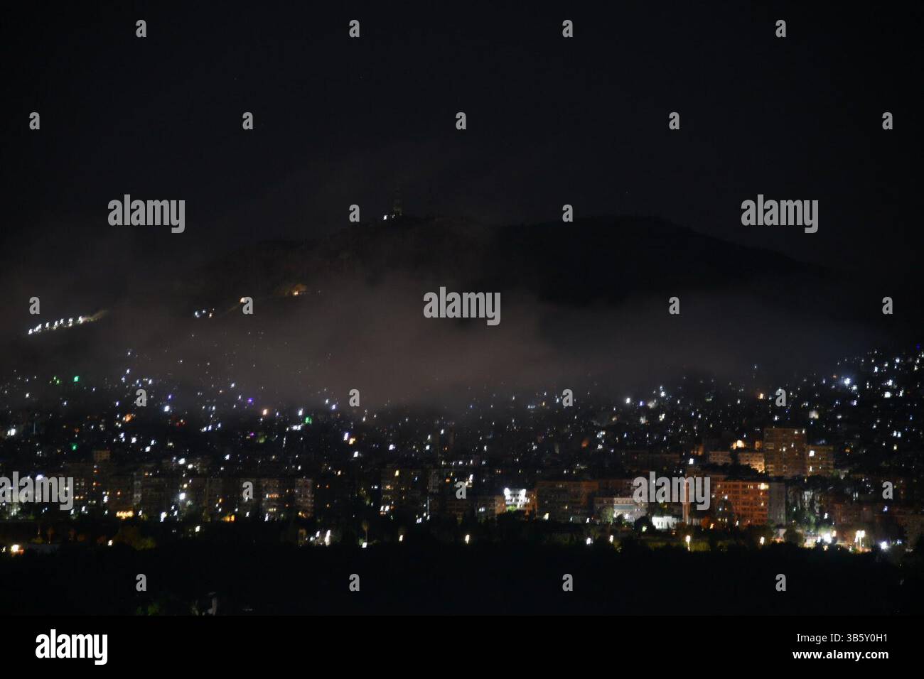 Damascus, Syria. 3rd May, 2025. Smoke rises from Mount Qasioun after an ...