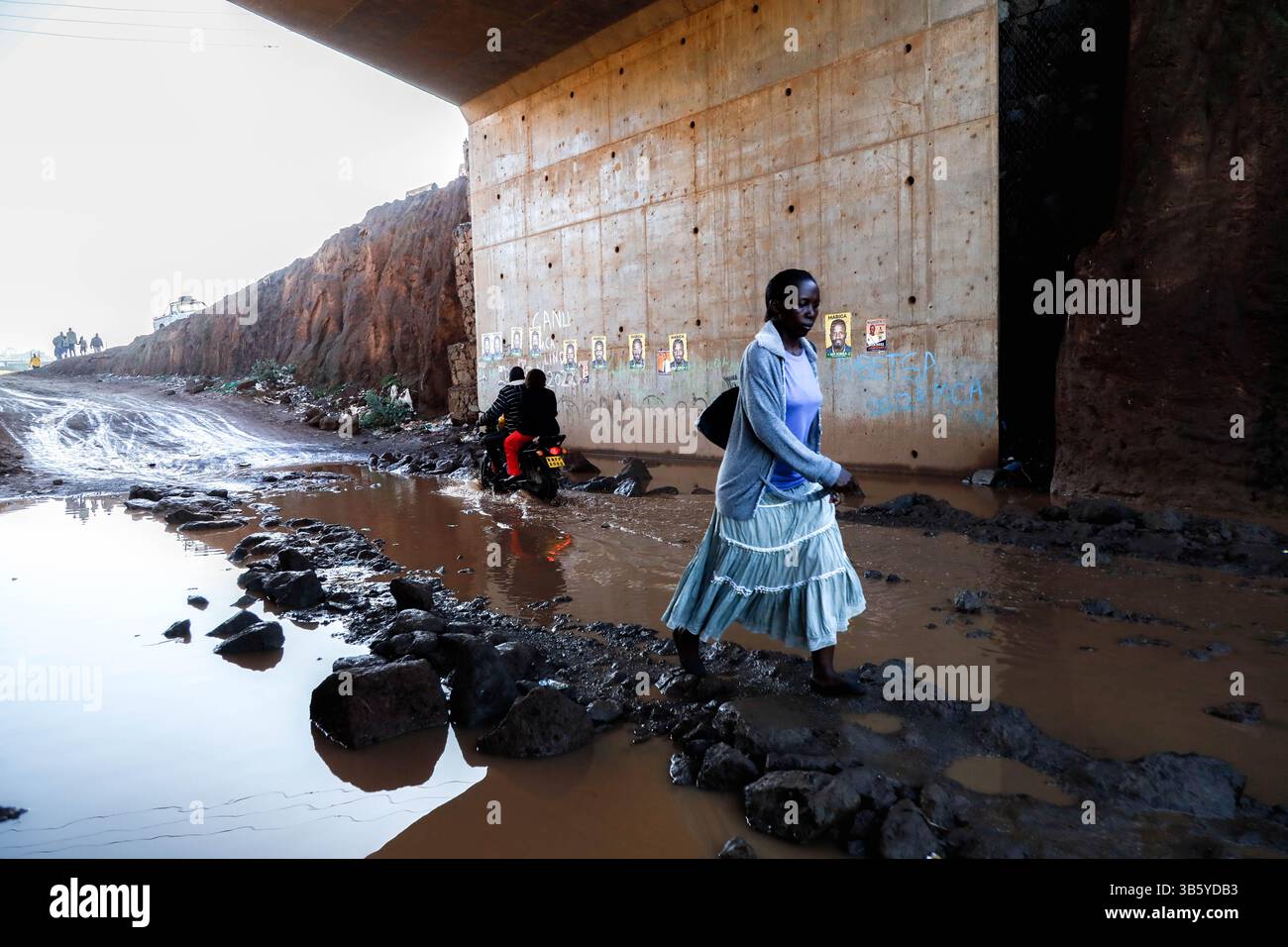 May 6, 2022, NAIROBI, KENYA: A woman walks past an unfinished ...