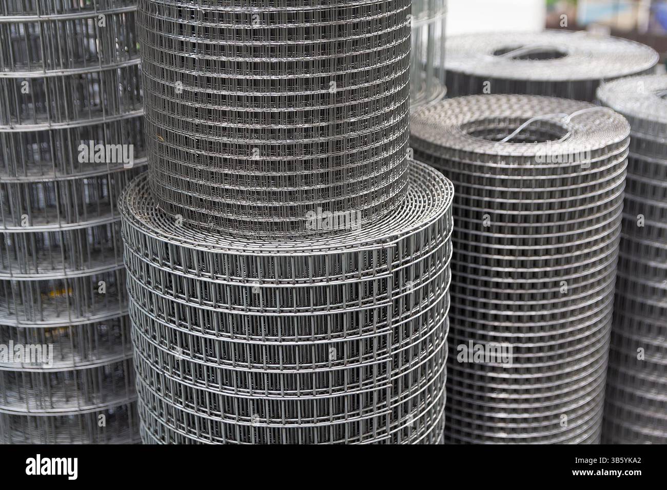 Roll of metal mesh with rectangular cells on the window of a ...