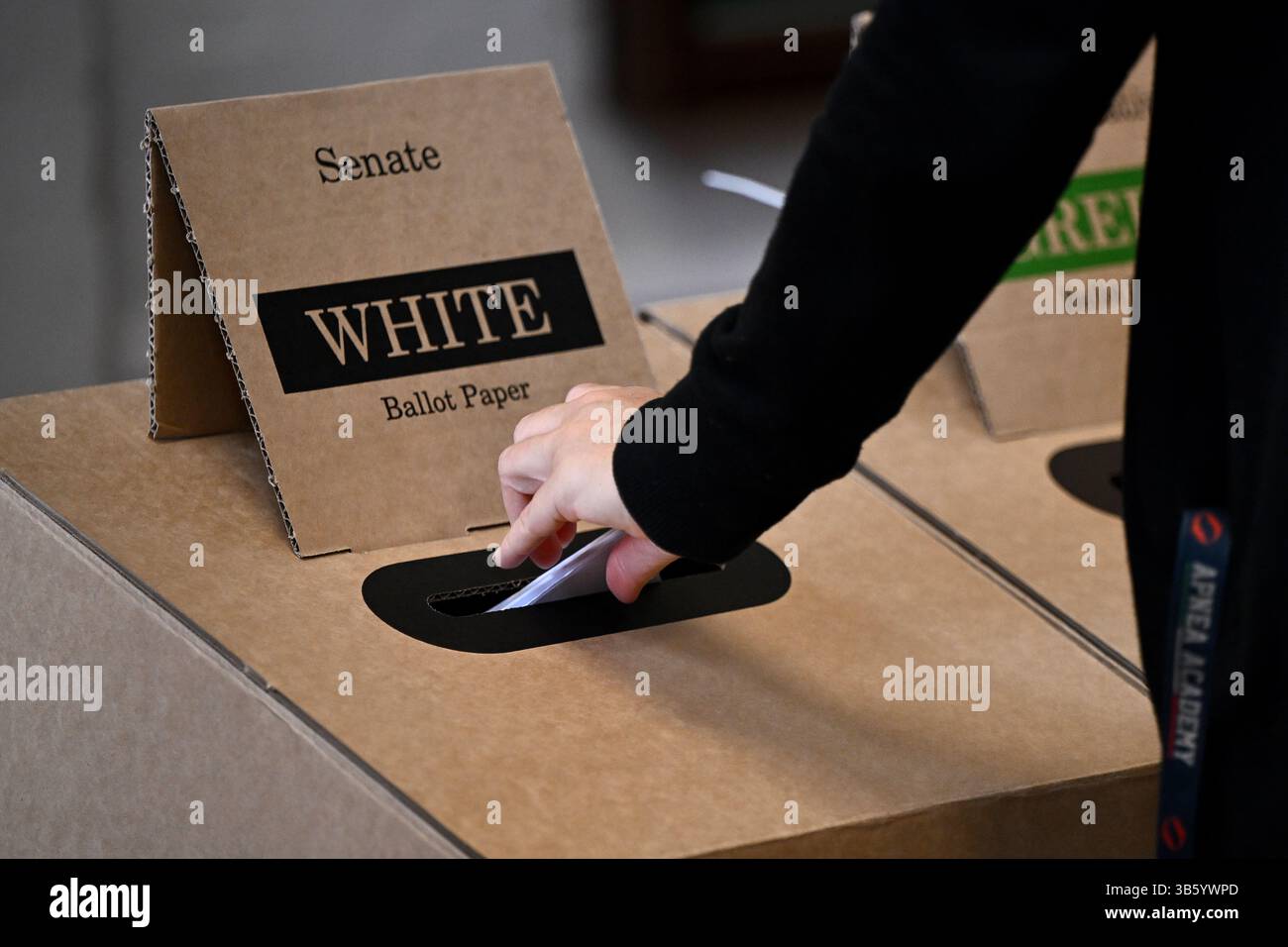 Sydney, Australia. 03rd May, 2025. People place their vote into ballot ...