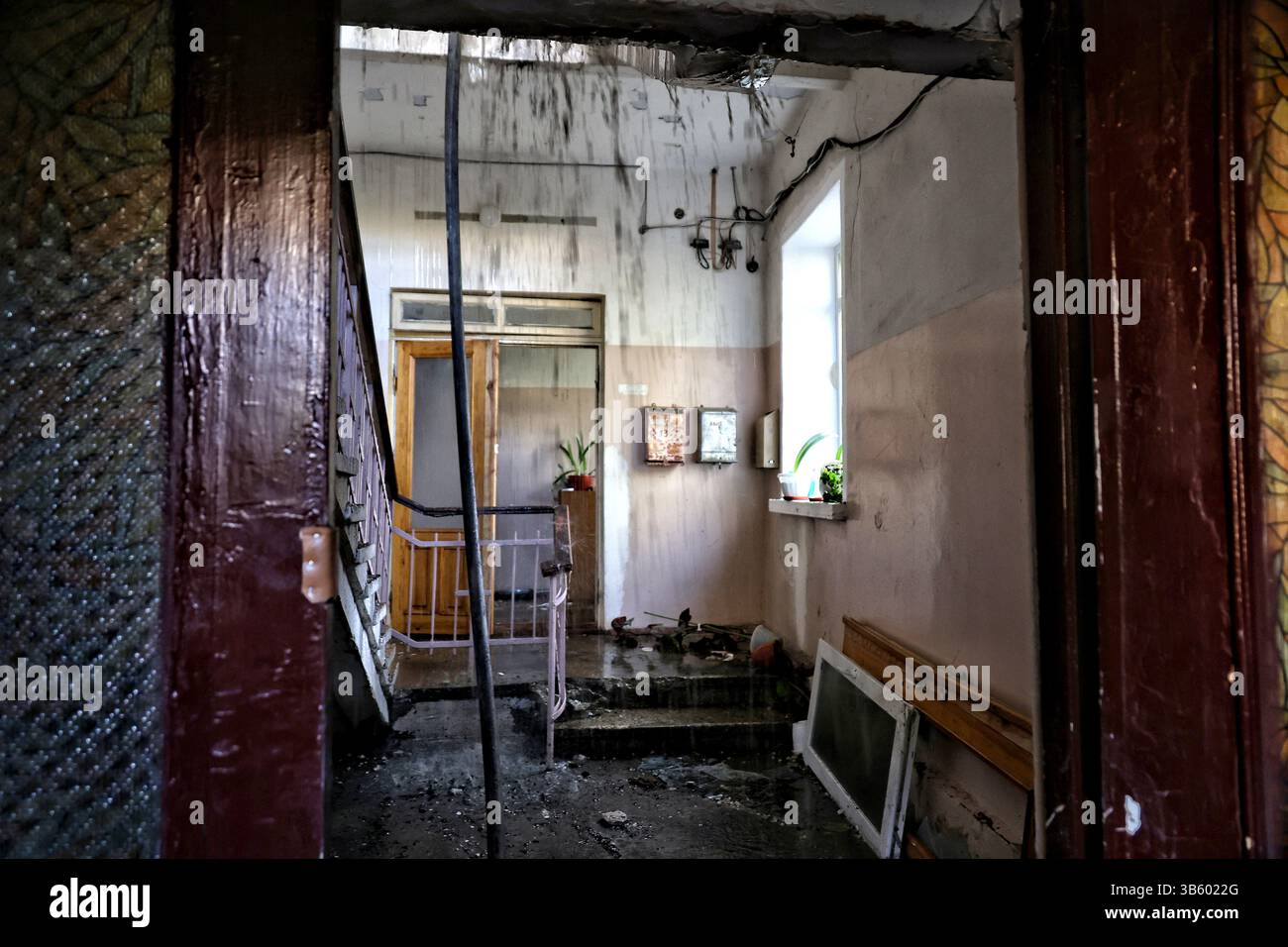 A residential building damaged by a nighttime Russian drone attack ...