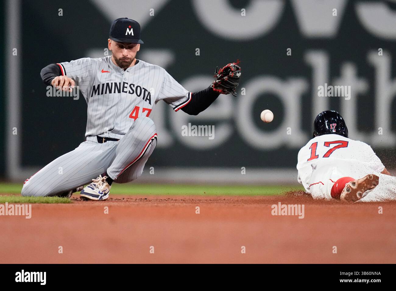 Minnesota Twins second base Edouard Julien (47) loses control of the ...