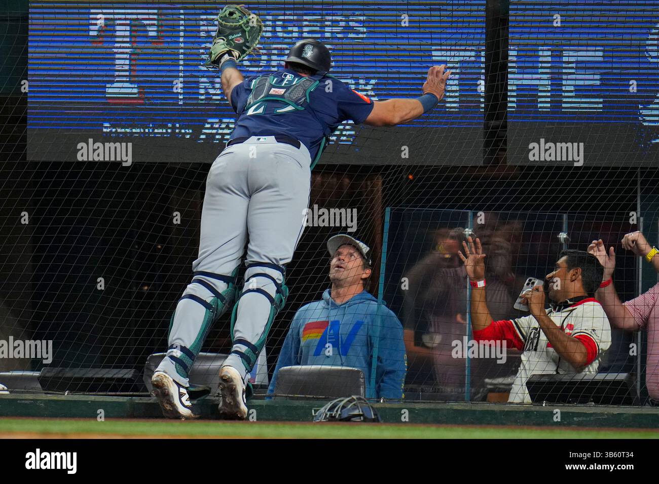 Seattle Mariners catcher Cal Raleigh makes a catch in foul territory ...