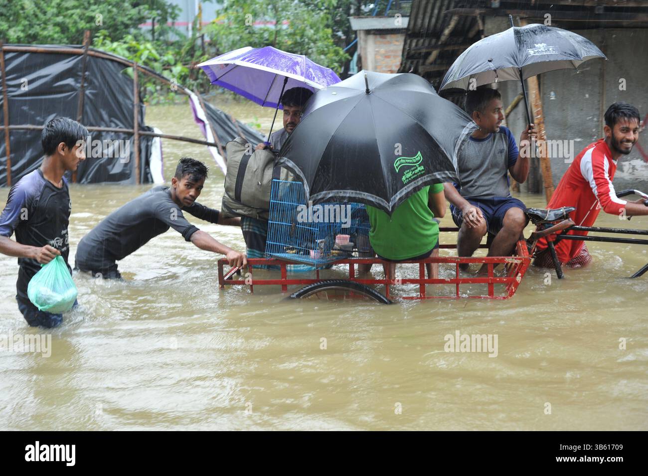 June 17, 2022: 17 June 2022, Sylhet -Bangladesh: People are going to a safe place during flood ...