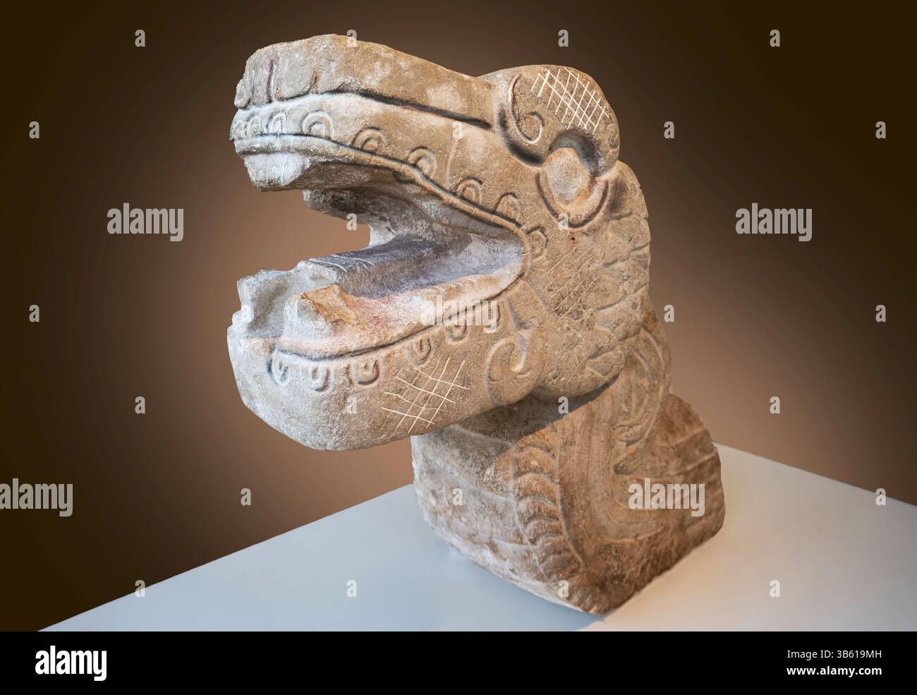 A plumed serpent. Post-classical Mayan Sculpture of a plumed serpent ...