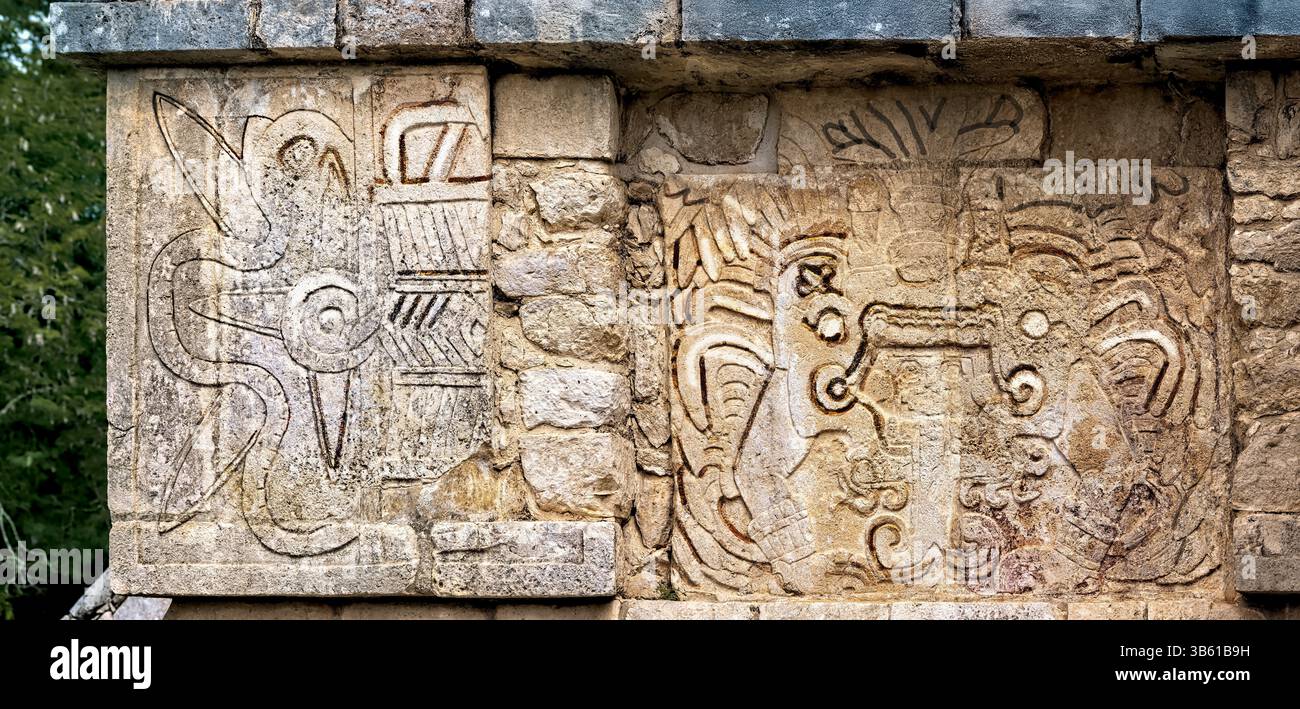 Details of bas-relief carvings on the wall of the El Templo Kukulcan ...