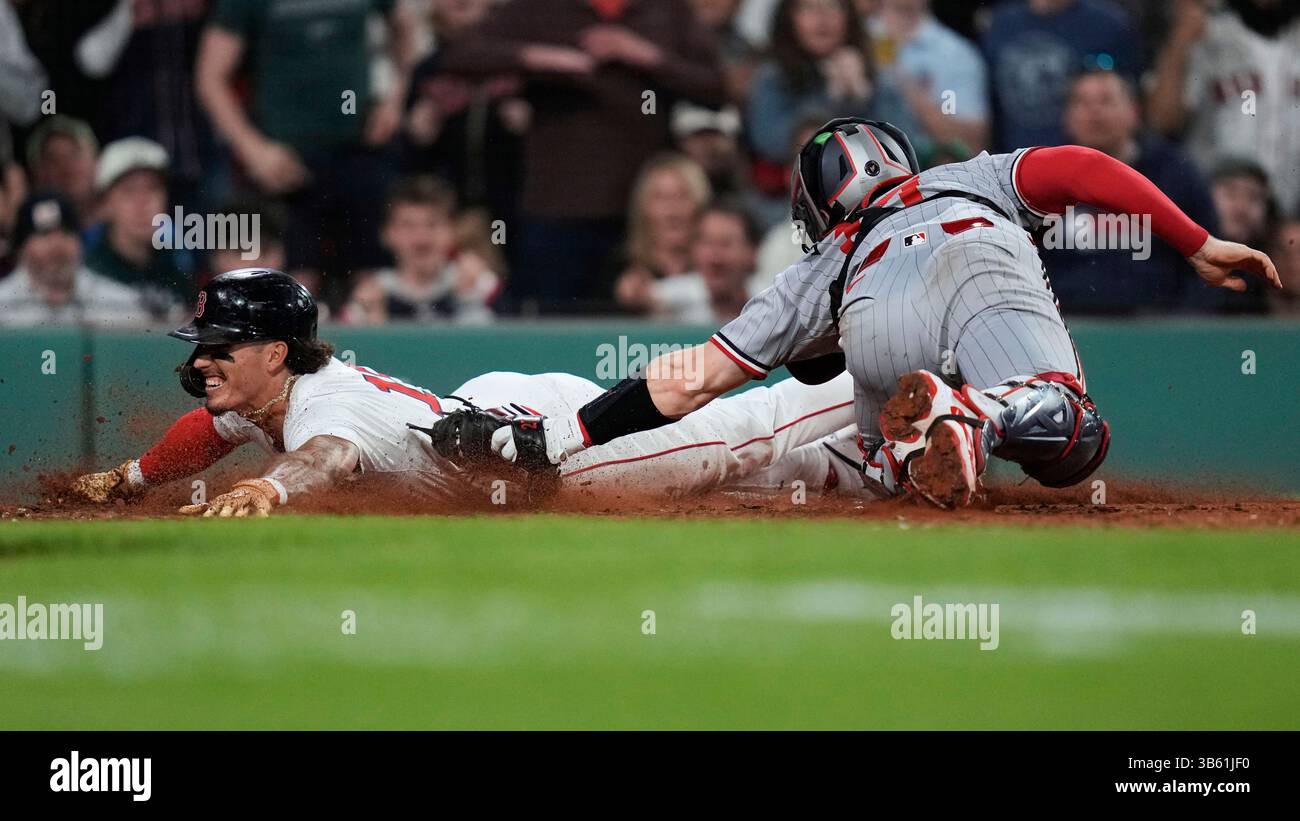 Boston Red Sox's Jarren Duran, left, is tagged out by Minnesota Twins ...