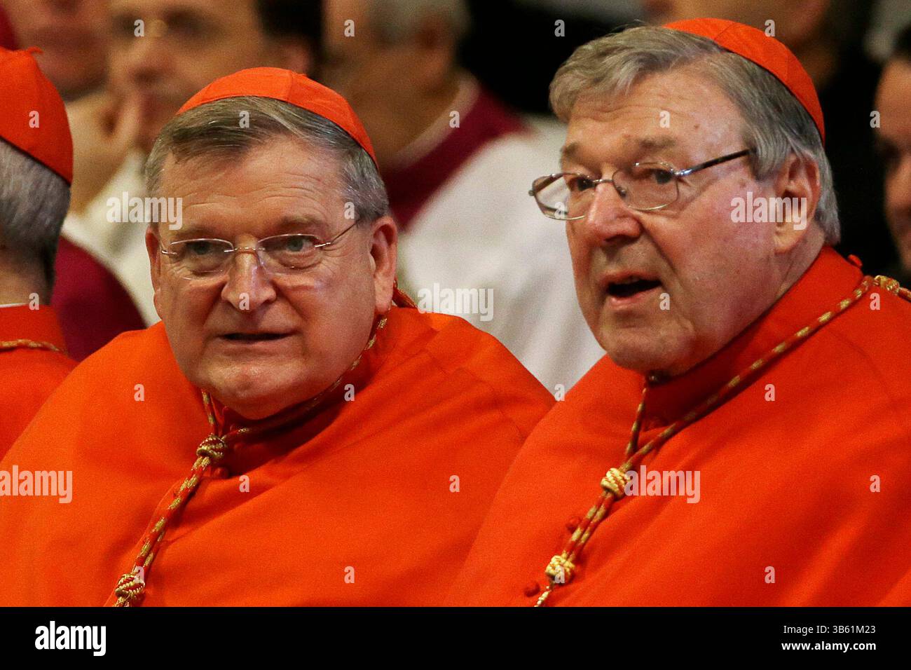 FILE - Cardinal Raymond Leo Burke, left, and Cardinal George Pell wait ...