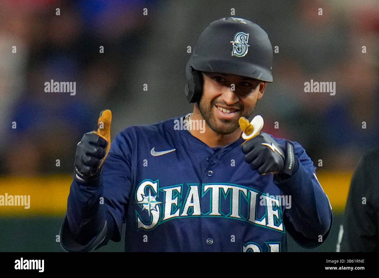 Seattle Mariners' Rhylan Thomas reacts after collecting his first major ...