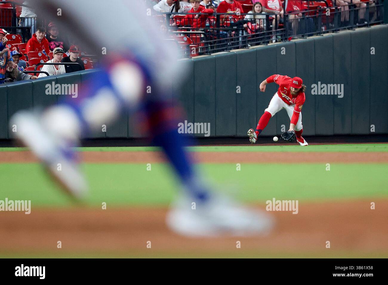 St. Louis Cardinals' Brendan Donovan fields a ball hit by New York Mets ...