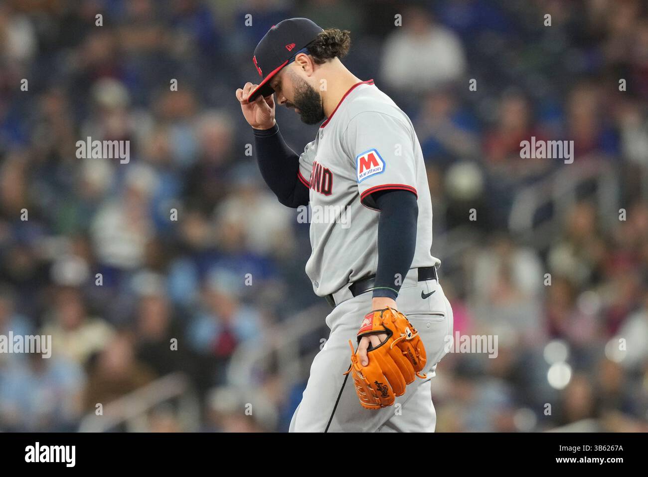 Cleveland Guardians pitcher Jakob Junis stands on the mound during ...