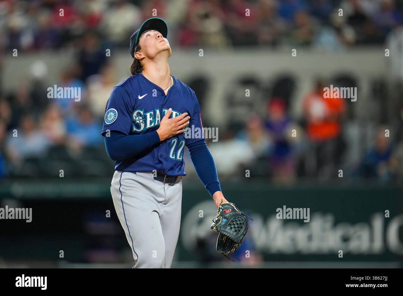 Seattle Mariners starting pitcher Bryan Woo reacts after being pulled ...