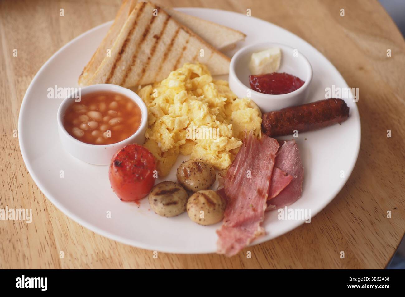 Delicious breakfast plate with eggs, toast, and beans served in a cafe ...