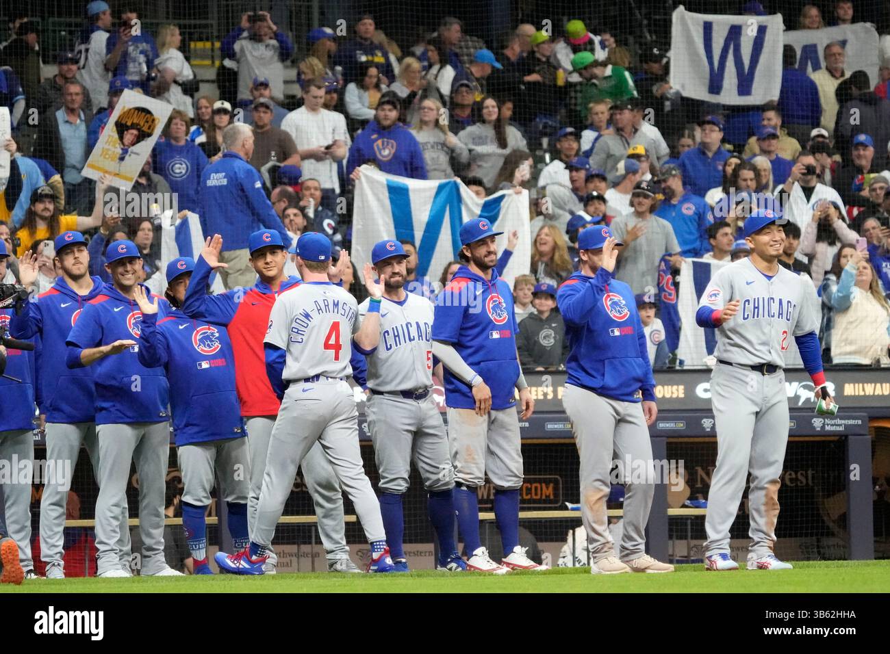 Chicago Cubs' Pete Crow-Armstrong (4) high-fives teammates after they ...