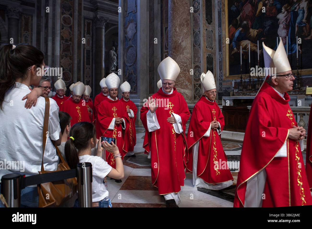 Cardinal Odilo Pedro Scherer greets children as he arrives for a mass ...