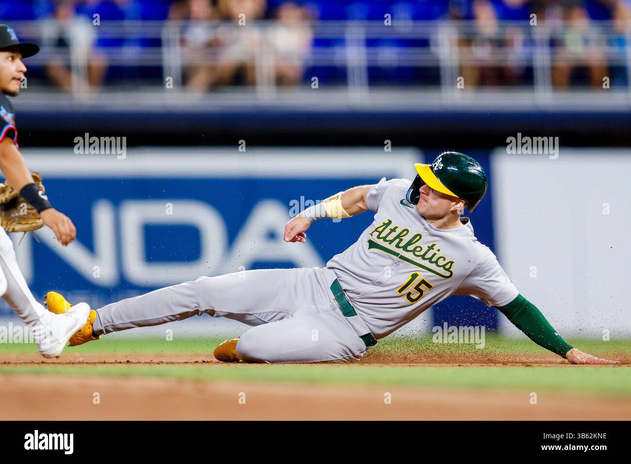 MIAMI, FL - MAY 02: Seth Brown #15 of the Oakland Athletics slides to ...