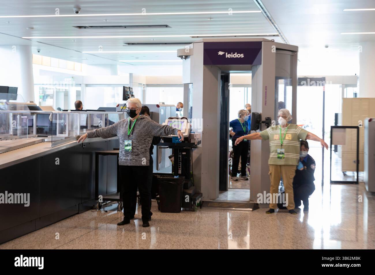 April 9, 2022, SeaTac, Washington, United States: Volunteers are patted ...