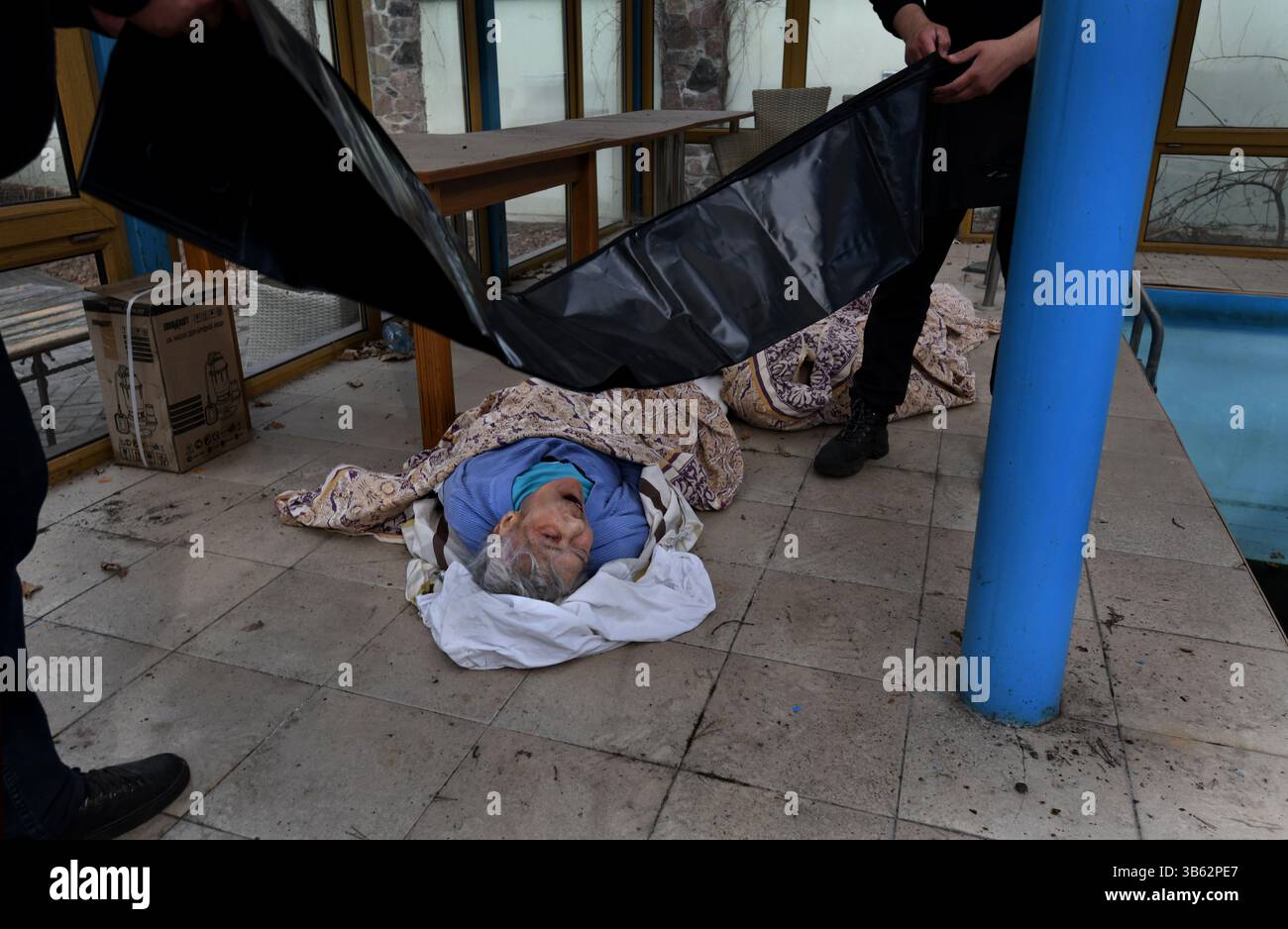 April 7, 2022, Bucha, Ukraine: Body collectors recover elderly that ...