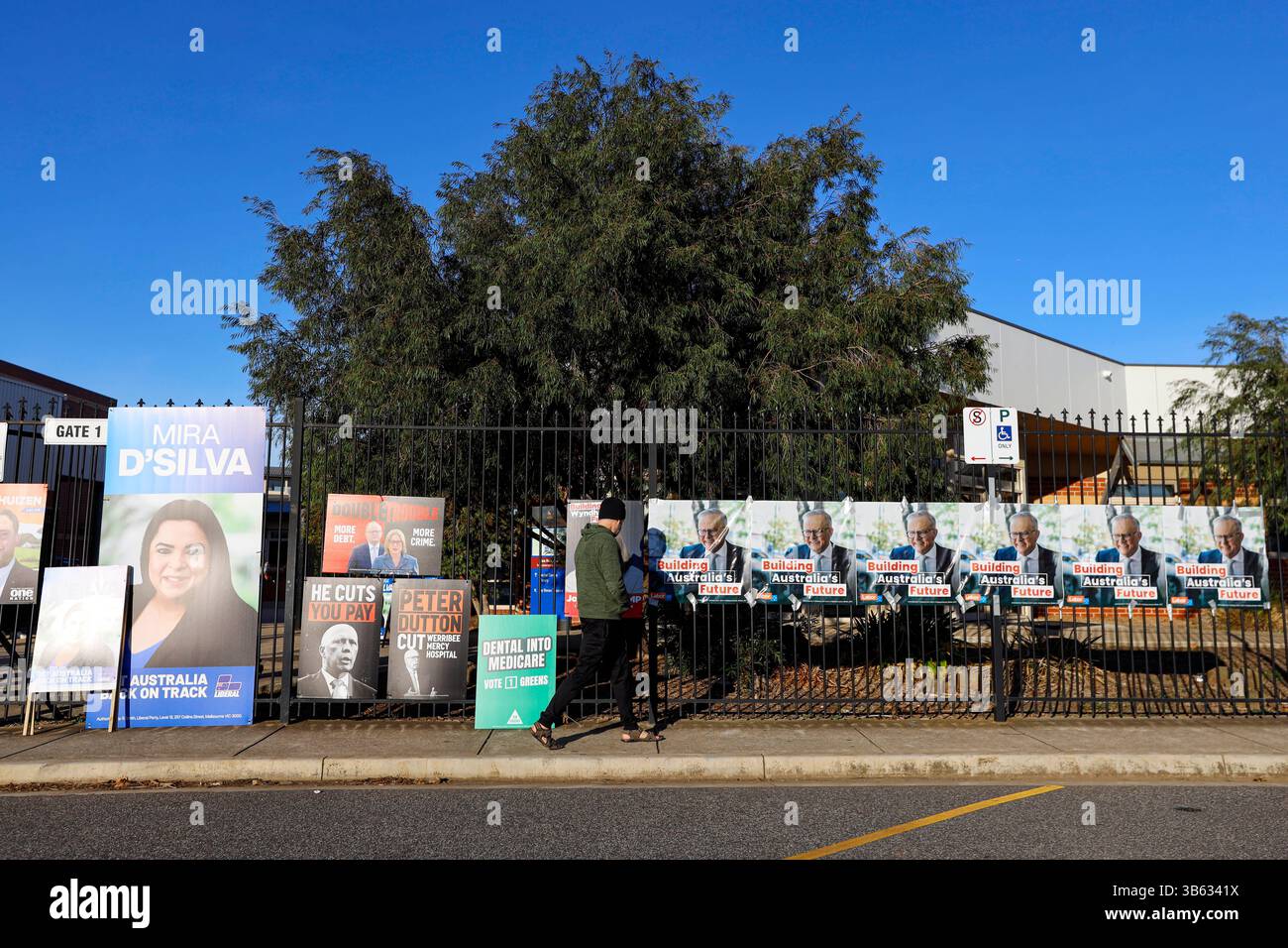 Campaign posters and signs are seen outside a polling centre on ...