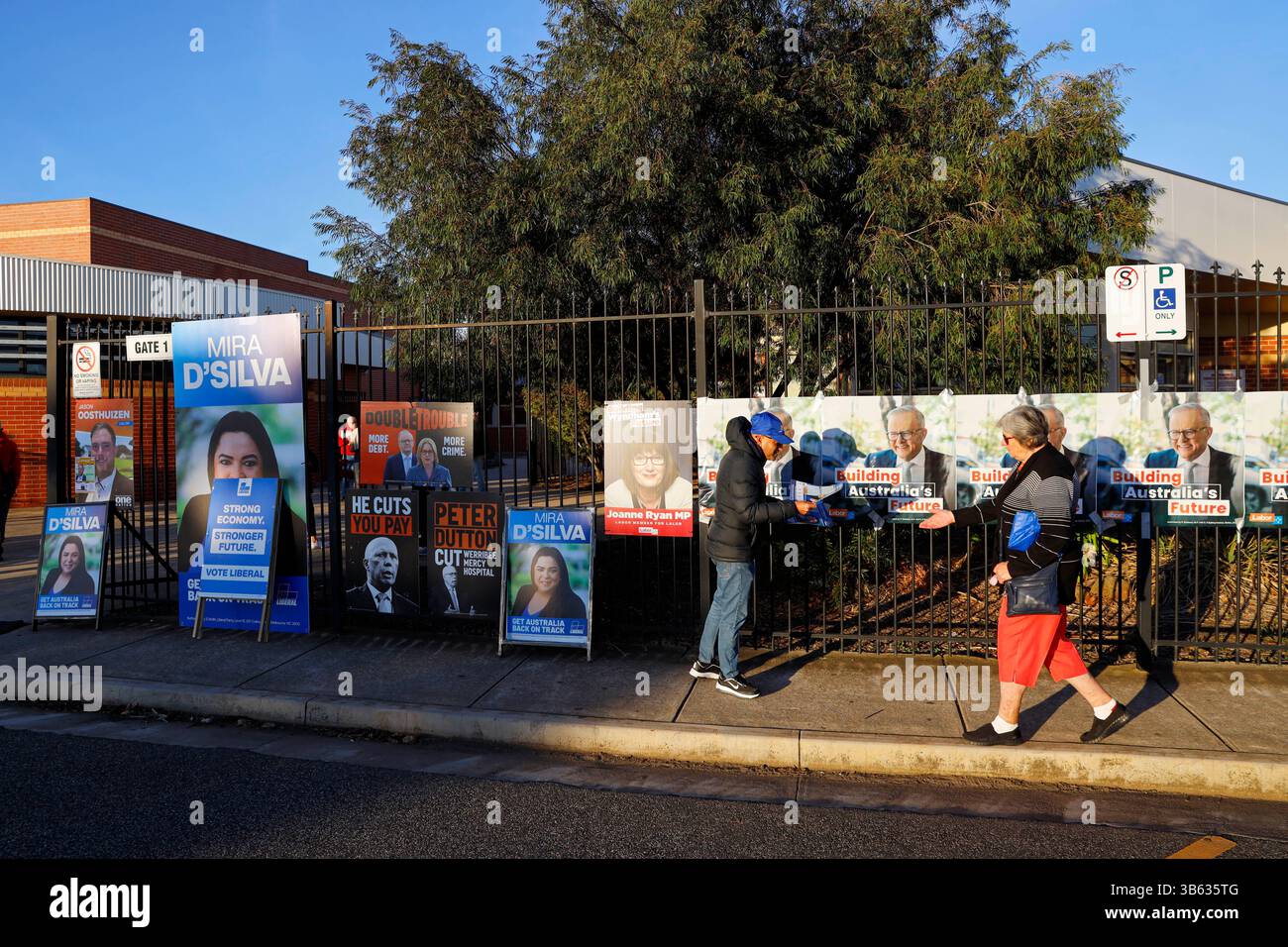 Campaign posters and signs are seen outside a polling centre on ...