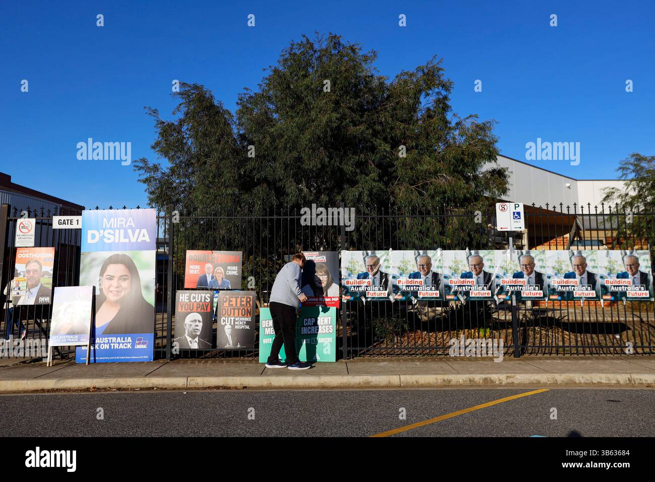 Campaign posters and signs are seen outside a polling centre on ...