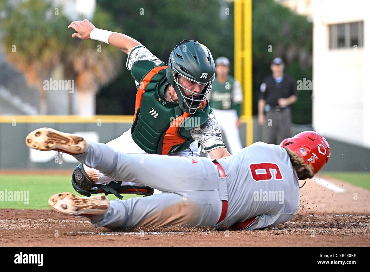 CORAL GABLES, FL - MAY 02: Miami catcher Tanner Smith (30) tags NC ...