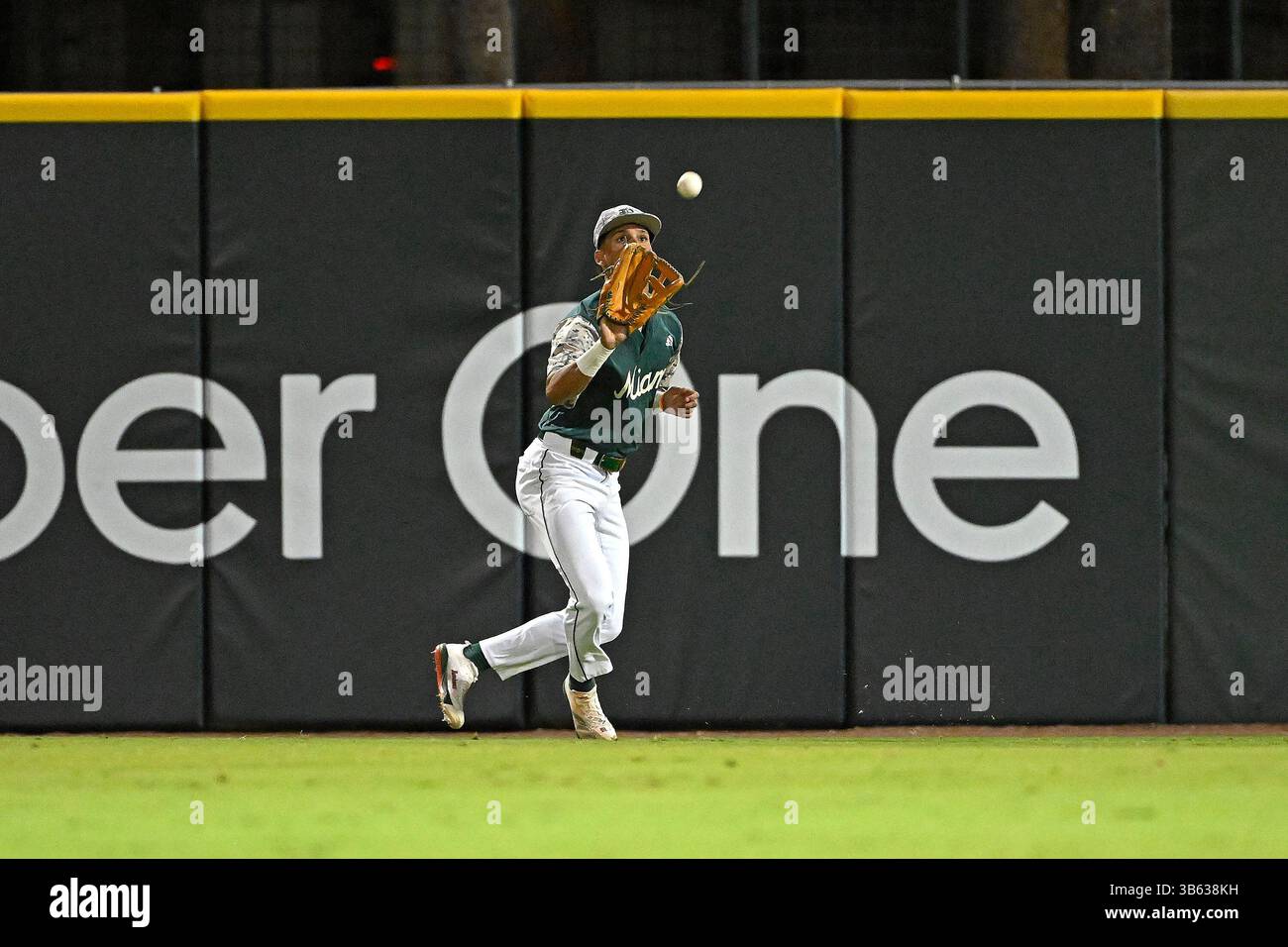 CORAL GABLES, FL - MAY 02: Miami outfielder Fabio Peralta (37) catches ...
