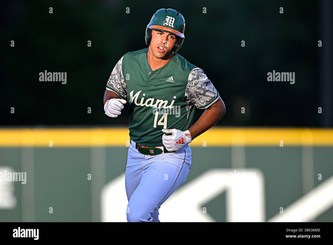 CORAL GABLES, FL - MAY 02: Miami infielder Daniel Cuvet (14) runs to ...