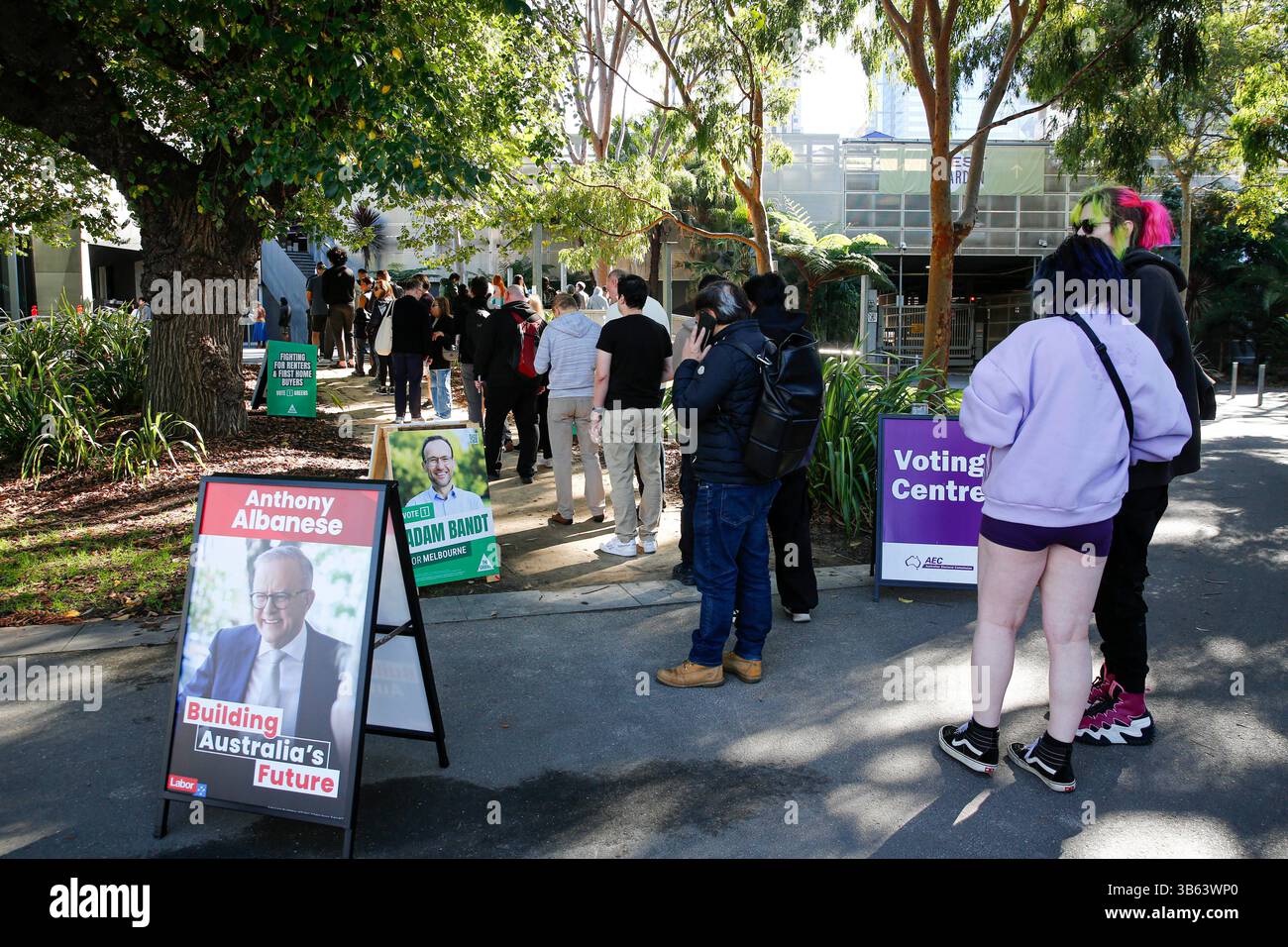Voters stand in line outside a polling centre on election day during ...