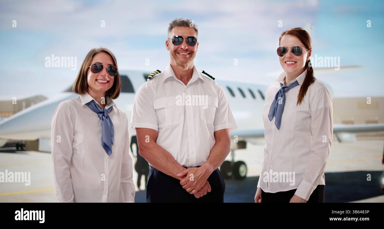 Professional Flight Crew In Uniform Near Private Jet At Airport Stock ...