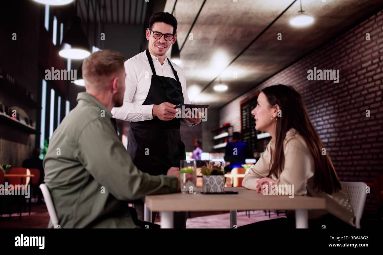 Young couple takes menu hi-res stock photography and images - Alamy