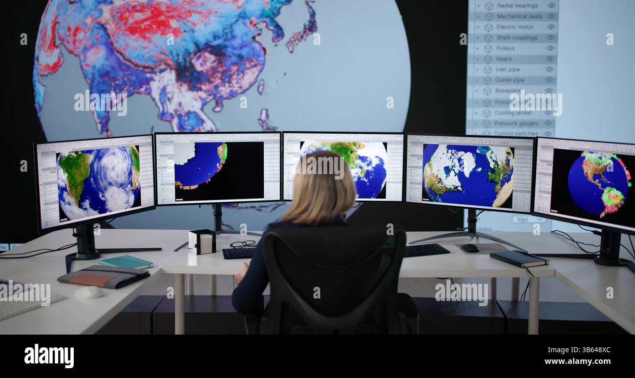 Female Scientist Using Computer To Analyze Global Weather Forecast Map Stock Photo - Alamy
