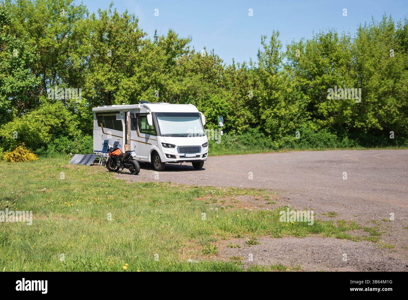 A wild camper in a car park Stock Photo - Alamy